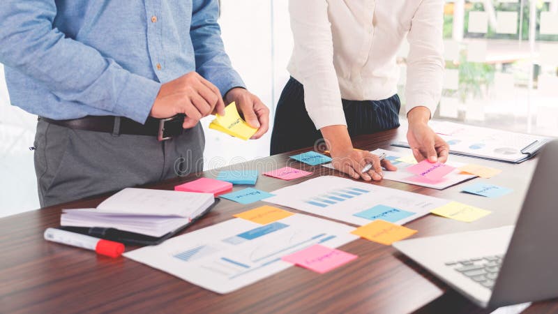 Businessman Stick Colorful Notes To Brainstorming on the Table Working ...
