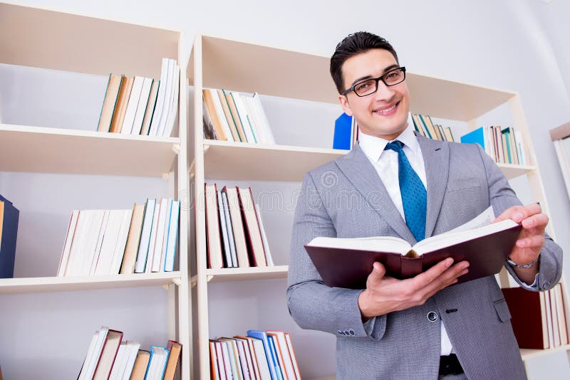 The Businessman Student Reading a Book Studying in Library Stock Photo ...