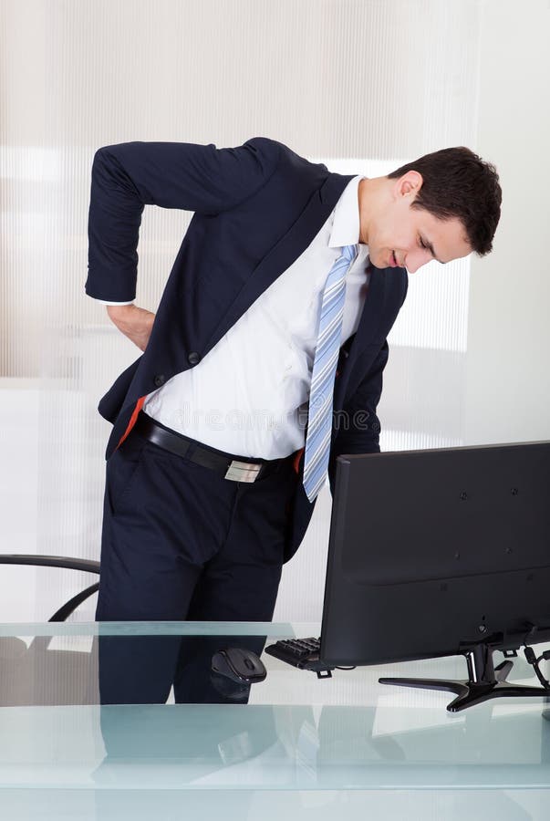 Businessman Suffering from Backache in Office Stock Image - Image of ...