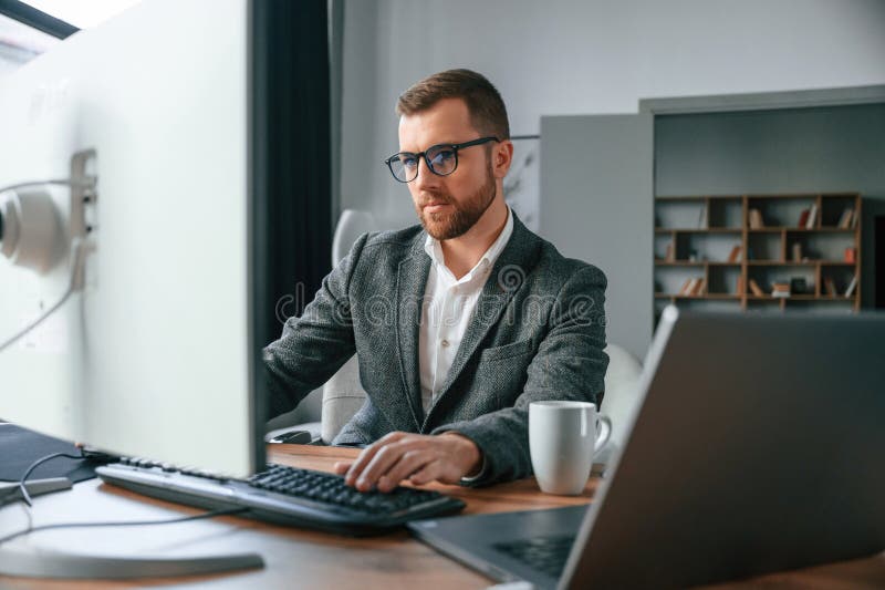Businessman in Suit is in the Office with Computer Stock Photo - Image ...