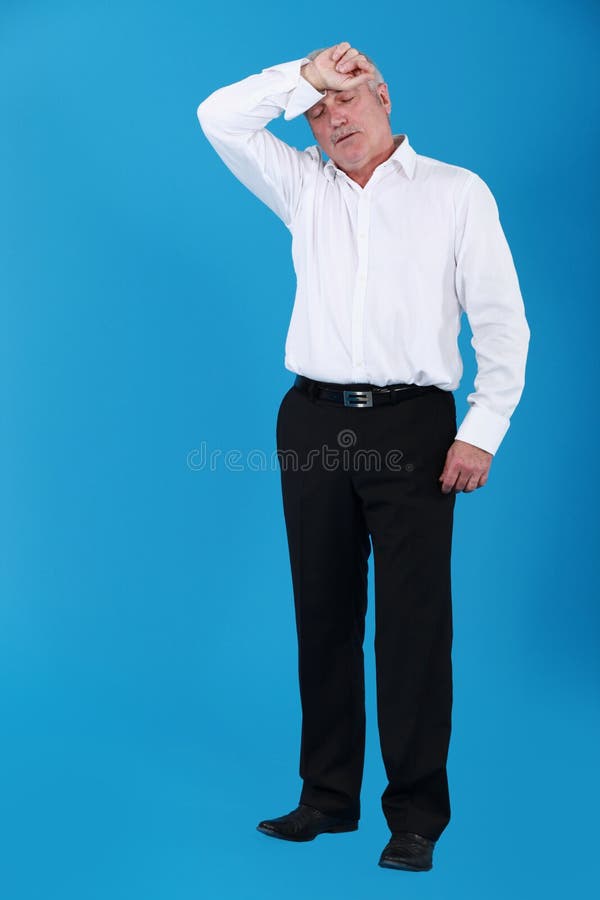 Attractive Young Man Holding a Thermometer and Sweating Stock Image ...