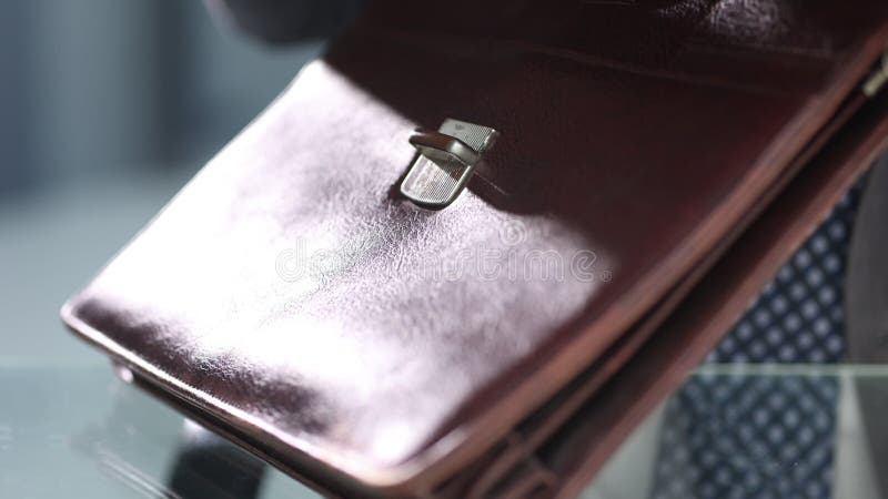 Lawyer Opens a Briefcase with Documents Sitting at a Table in the ...