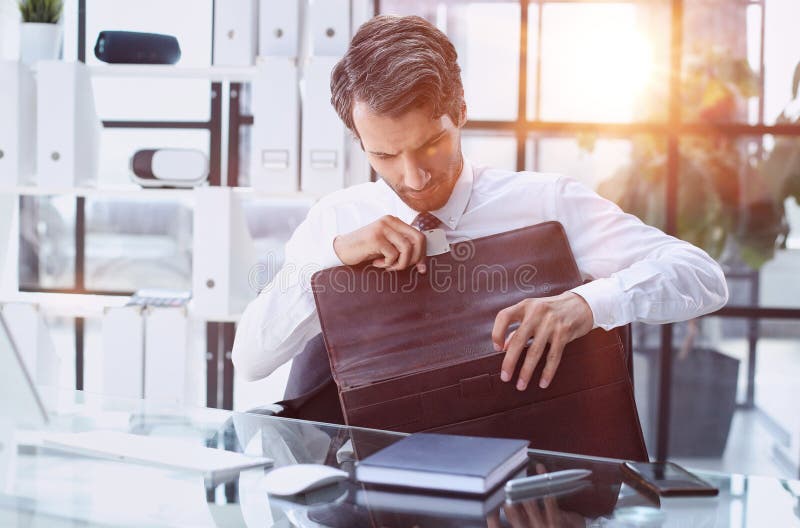 Businessman by Table and Opening His Briefcase Stock Image - Image of ...