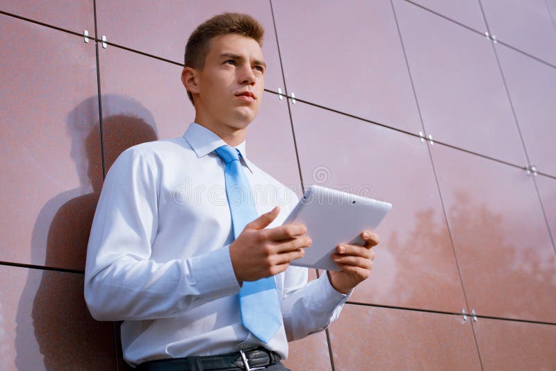 Businessman with Tablet Computer Looking Away Stock Photo - Image of ...