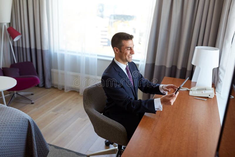 Businessman with Tablet Pc Working at Hotel Room Stock Photo - Image of ...