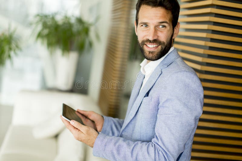 Businessman with tablet stock image. Image of tablet - 81166071