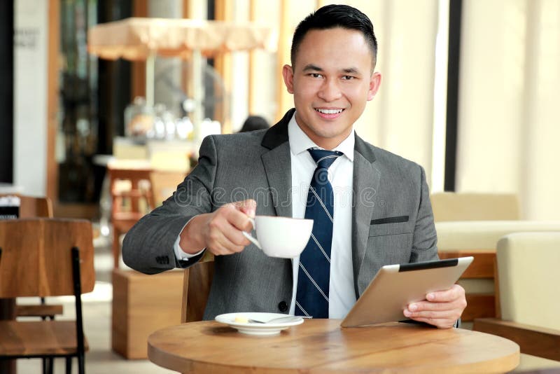 Businessman Taking a Break at Coffee Shop Stock Image - Image of ...