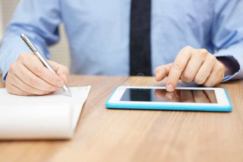 Businessman Taking Business Notes and Working on Tablet Computer Stock ...