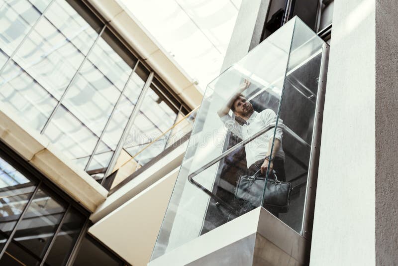 Businessman Taking the Elevator Stock Image - Image of inside, person ...