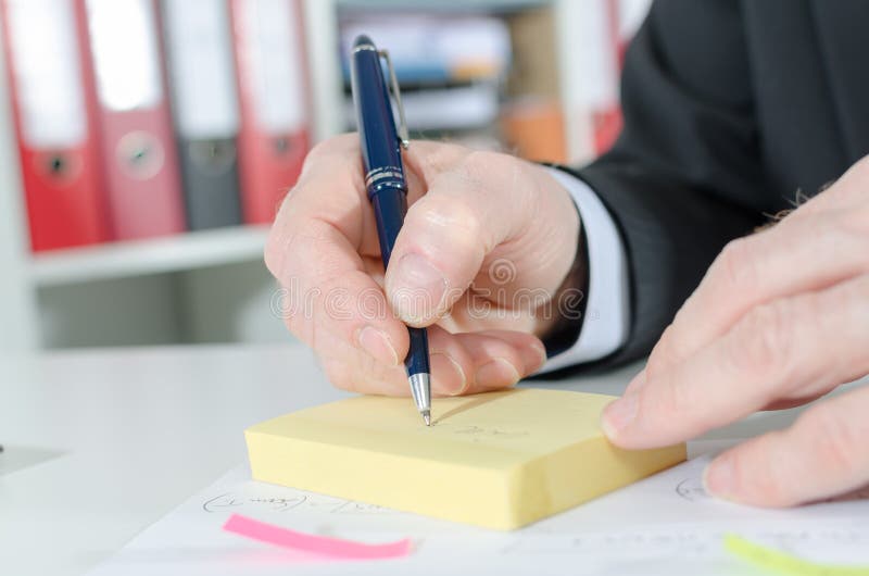 Businessman taking notes stock image. Image of paper - 57856901