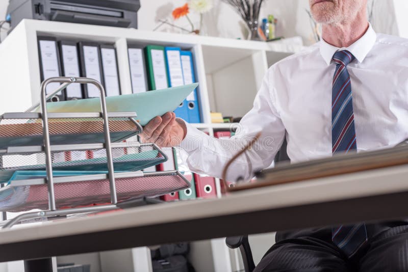 Businessman Taking a Record of His Paper Tray Stock Image - Image of ...