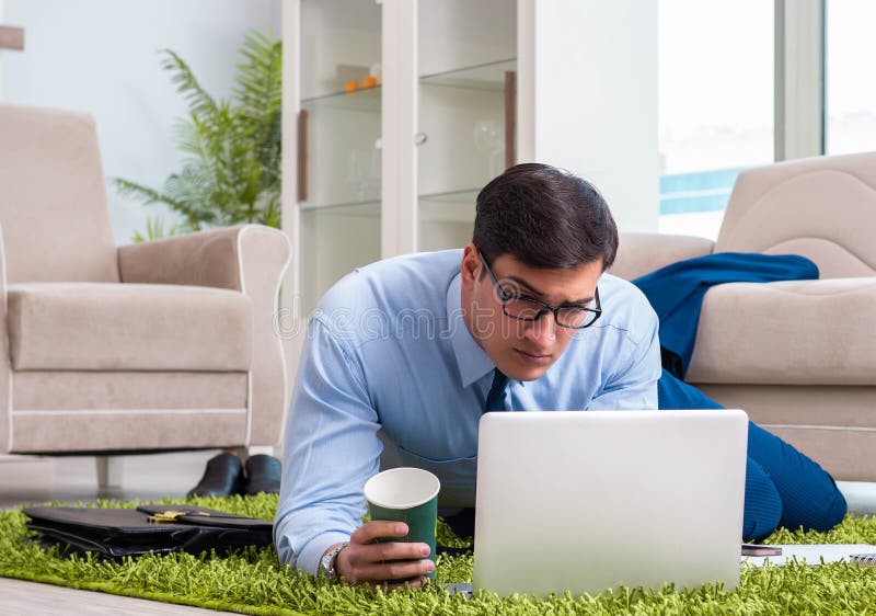 Businessman Taking Work Home and Working Overtime Stock Image - Image ...