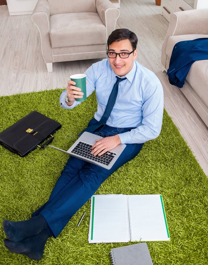 Businessman Taking Work Home and Working Overtime Stock Image - Image ...