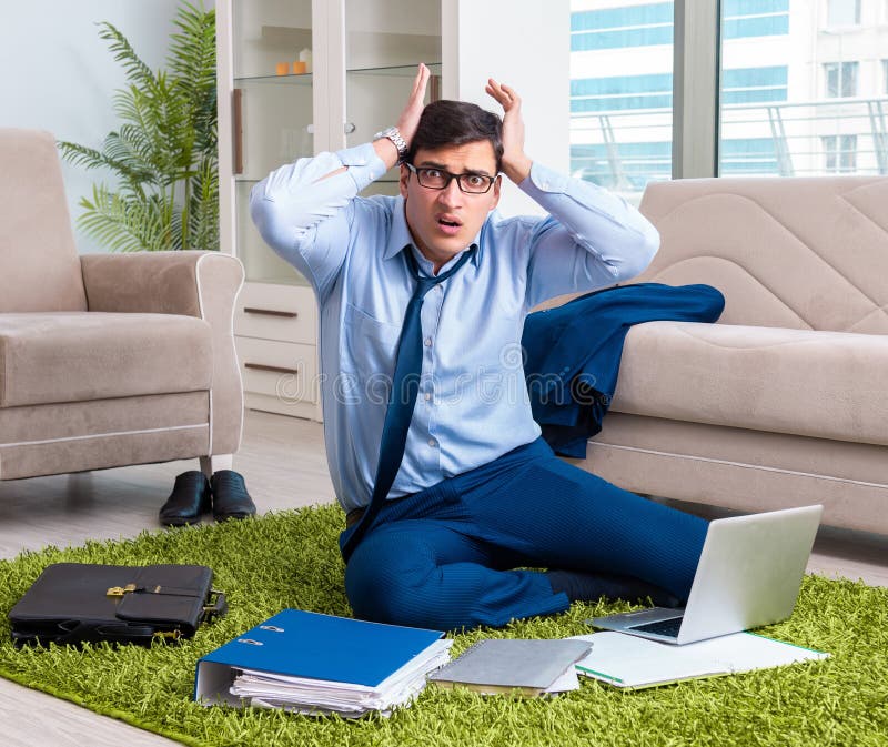 Businessman Taking Work Home and Working Overtime Stock Photo - Image ...