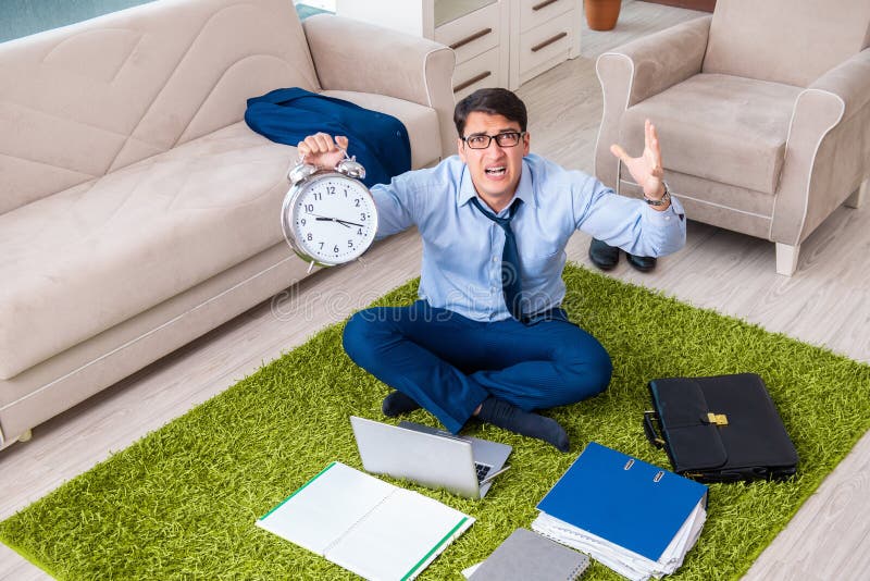 The Businessman Taking Work Home and Working Overtime Stock Photo ...