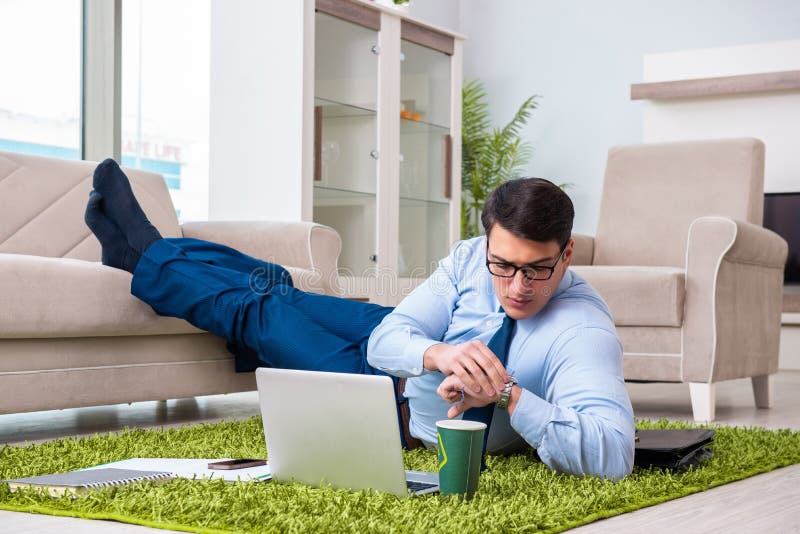 The Businessman Taking Work Home and Working Overtime Stock Photo ...