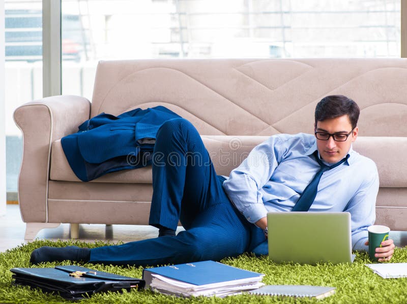 Businessman Taking Work Home and Working Overtime Stock Image - Image ...