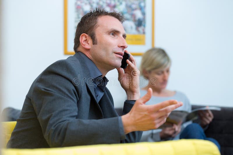 Businessman Talking on Mobile Phone in Waiting Area Stock Photo - Image ...