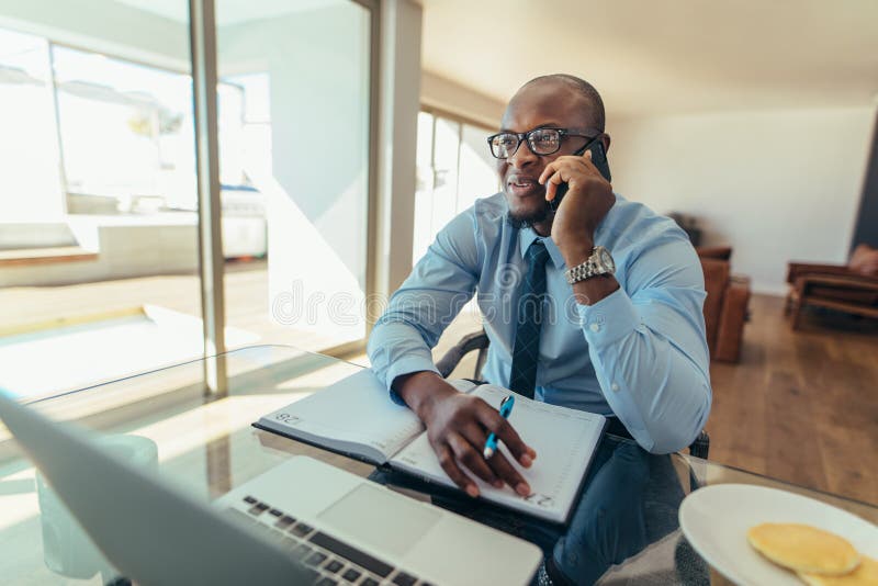 Businessman Talking Over Mobile Phone at Work Stock Photo - Image of ...
