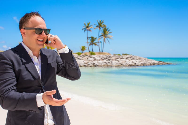 Businessman Talking on Phone at the Beach Stock Photo - Image of ...