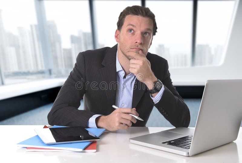 Businessman Thinking at Computer Laptop Desk Looking Reflexive a Stock ...