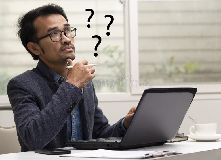 Businessman Thinking and Question Mark at Workplace Stock Image - Image ...