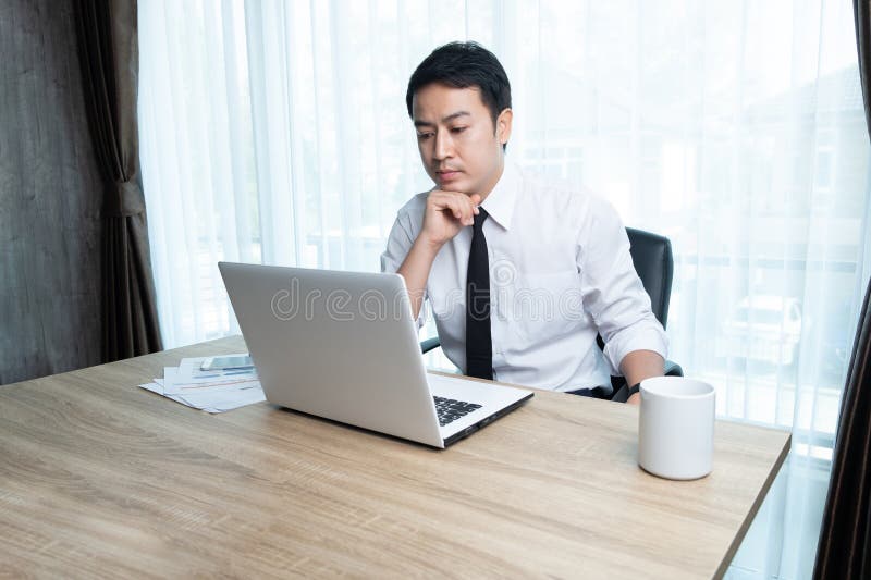 An Asian Businessman Thinking Stock Photo - Image of occupation ...