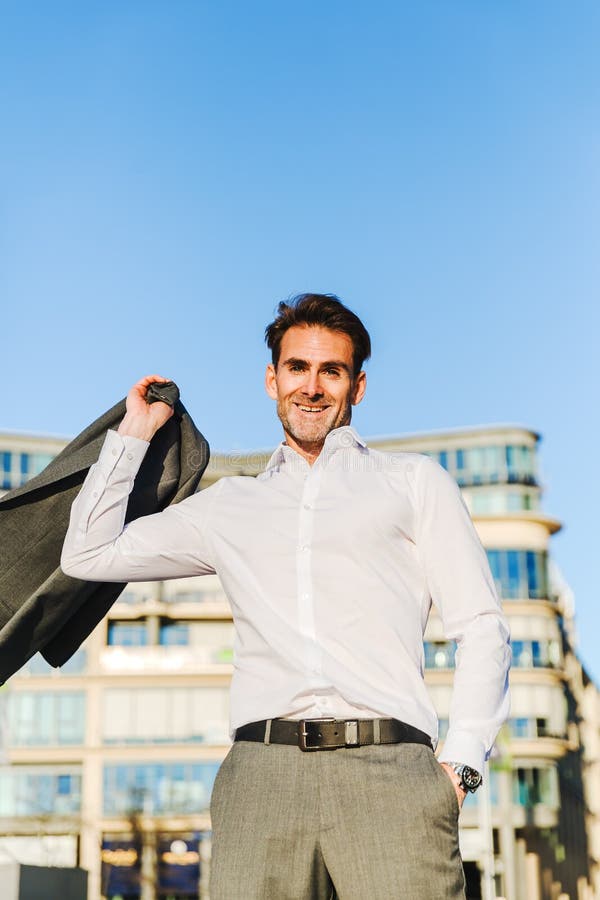 Businessman Throws His Jacket Over the Shoulder Stock Photo - Image of ...