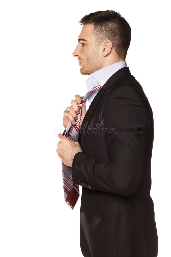 Businessman tied his tie stock image. Image of studio - 30334265