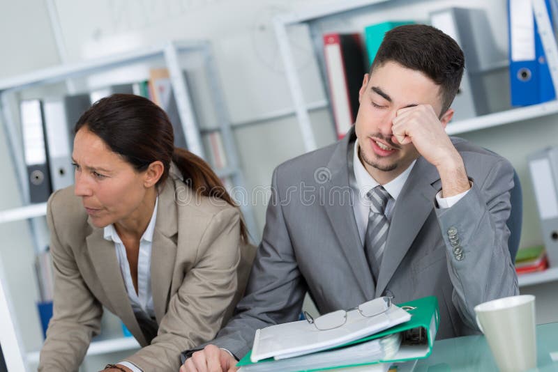Businessman Tired Solving Problem in Office with Co-worker Stock Photo ...