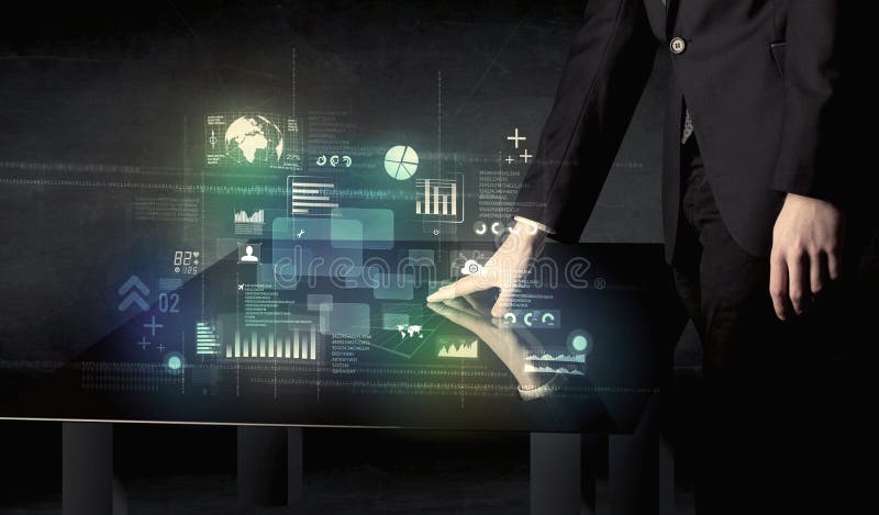 Businessman Touching Interactive Modern Desk with Technology Icons ...