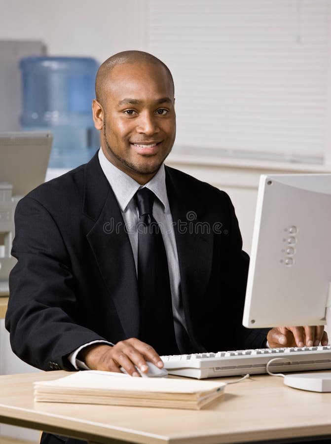 Businessman Typing on Computer at Desk Stock Image - Image of shoulders ...