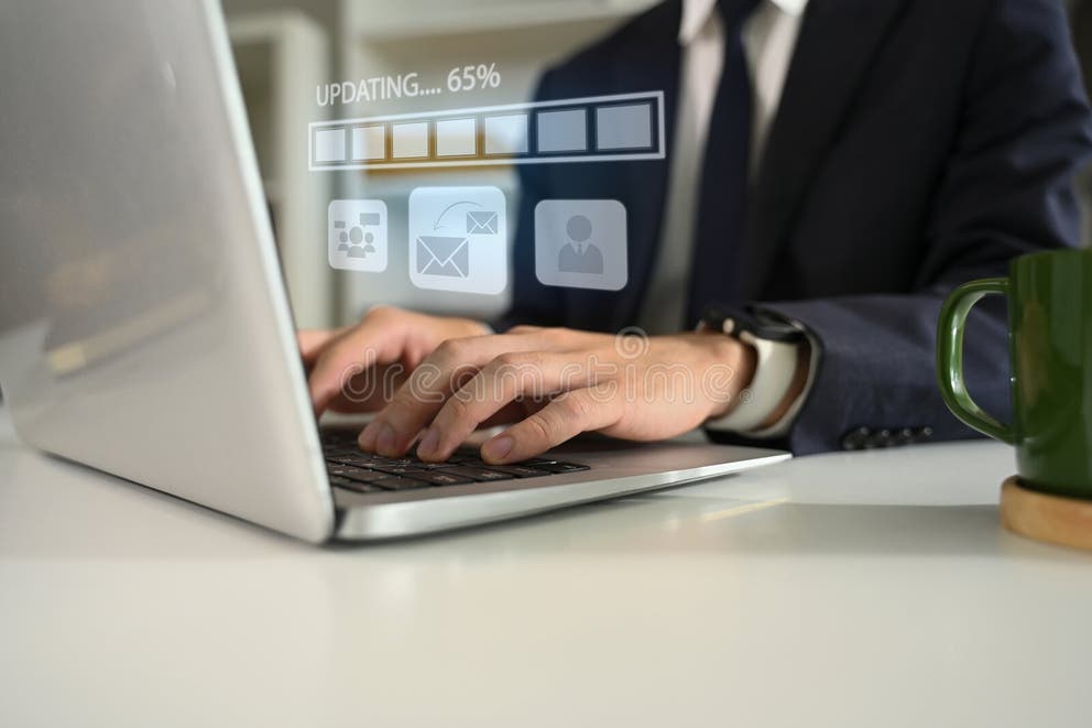 Businessman Typing on Laptop Keyboard with Visual Software Update ...