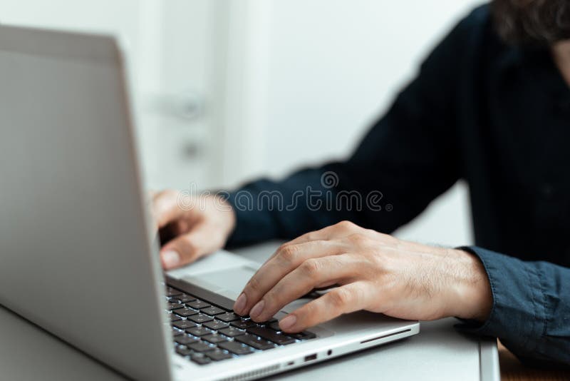 Businessman Typing Recent Updates on Lap Top Keyboard on Desk. Man in ...