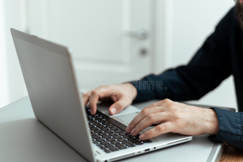 Businessman Typing Recent Updates on Lap Top Keyboard on Desk. Man in ...