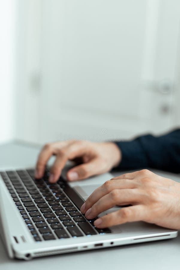 Businessman Typing Recent Updates on Lap Top Keyboard on Desk. Man in ...