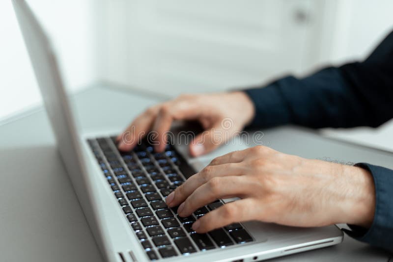 Businessman Typing Recent Updates on Lap Top Keyboard on Desk. Man in ...