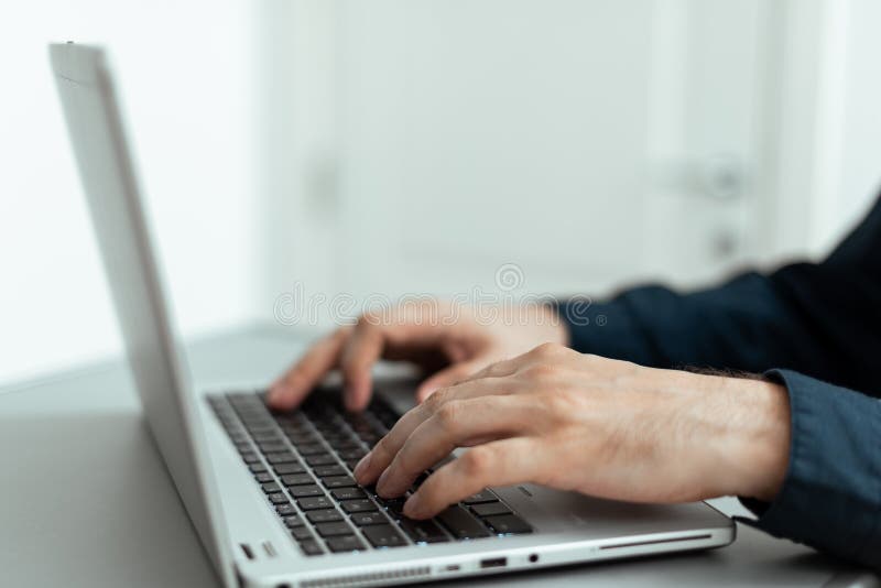 Businessman Typing Recent Updates on Lap Top Keyboard on Desk. Man in ...