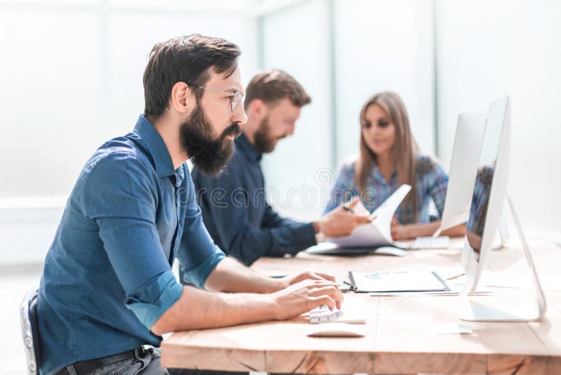 Businessman Uses a Computer in the Workplace in the Office. Stock Photo ...