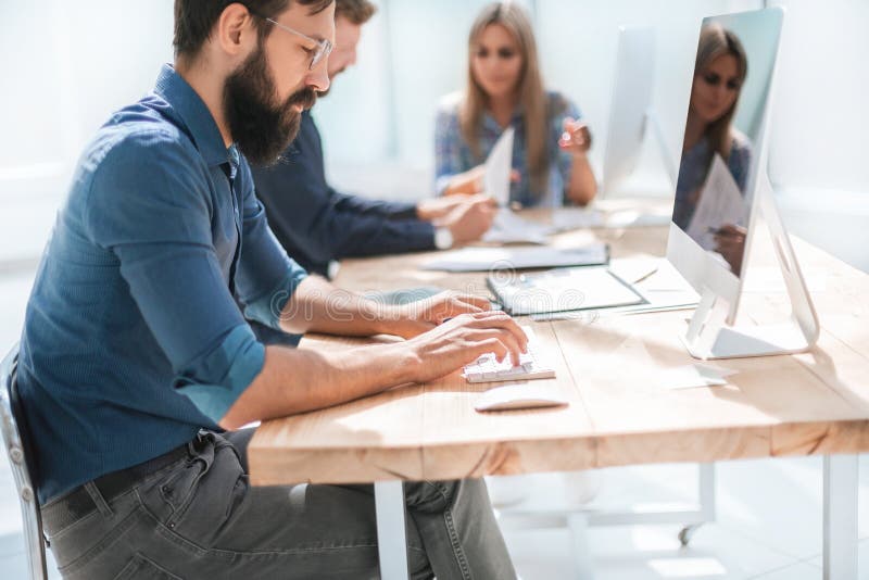 Businessman Uses a Computer in the Workplace in the Office. Stock Photo ...