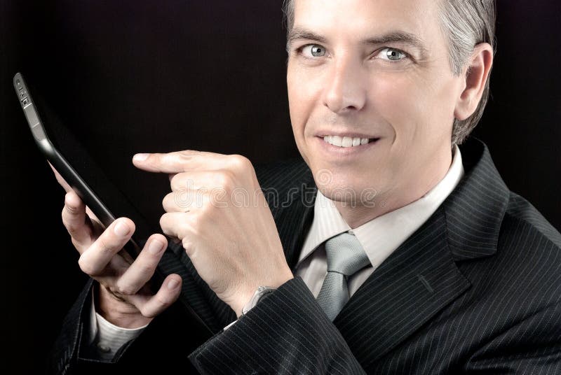 Businessman Uses Tablet stock image. Image of elegance - 34287555