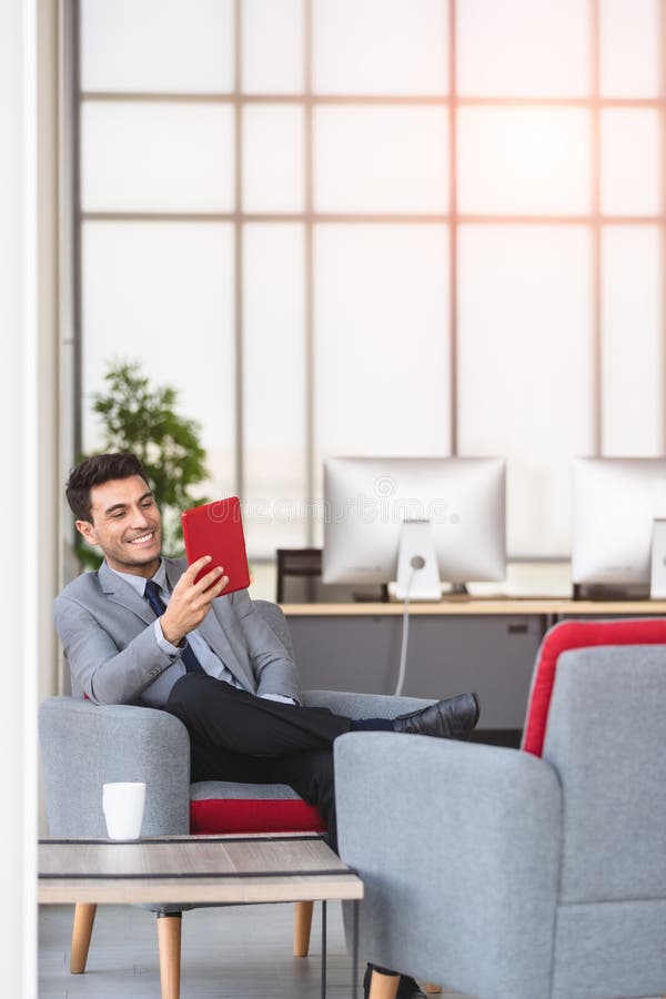 Businessman Uses Tablet Computer in Break Time Stock Photo - Image of ...