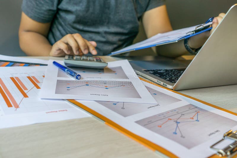 Close Up of Human Hands Using Calculator , Holding Document Stock Photo ...