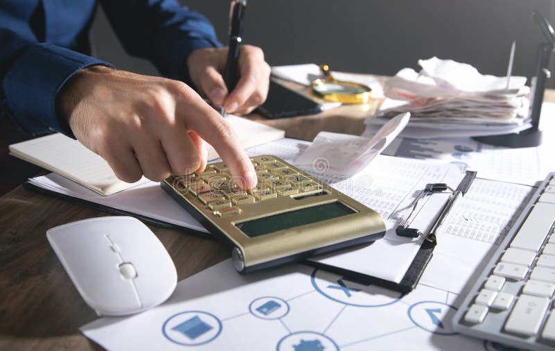 Businessman Using Calculator and Checking Bills. Business Stock Photo ...