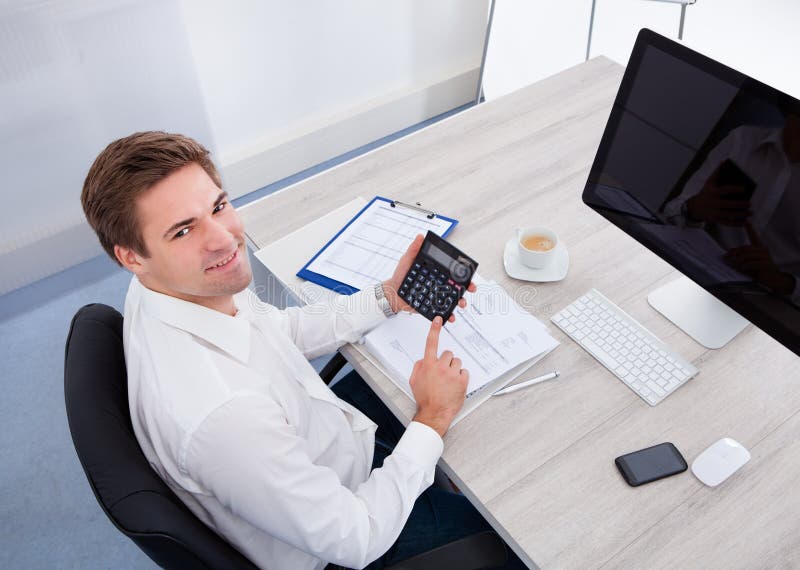 Businessman Using Calculator Stock Image - Image of facial, male: 53444541 Businessman Using Calculator Stock Image - Image of facial, male: 53444541