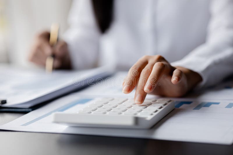 Businessman is Using a Calculator To Calculate Company Financial ... Businessman is Using a Calculator To Calculate Company Financial ...
