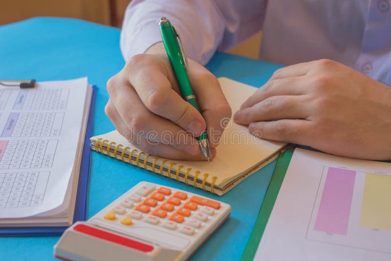 Businessman Using a Calculator To Calculate the Numbers. Businessman ...