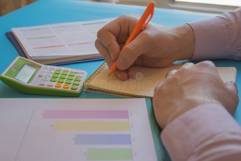 Businessman Using a Calculator To Calculate the Numbers. Businessman ...