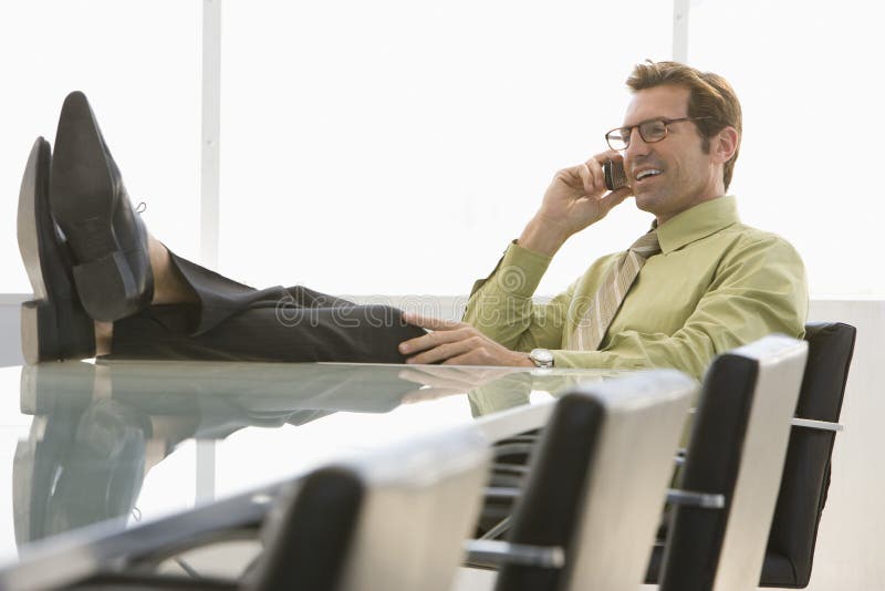 Businessman Using Cell Phone in Conference Room Stock Image - Image of ...