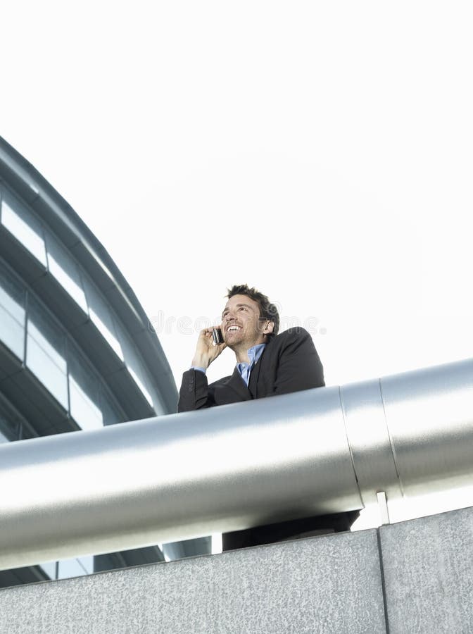 Businessman Using Cell Phone Outside Office Building Stock Photo ...